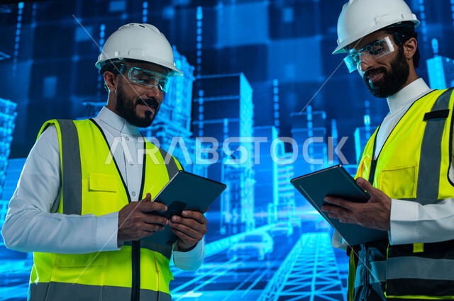 Follow-up of advanced engineering designs using a tablet, two Saudi ...