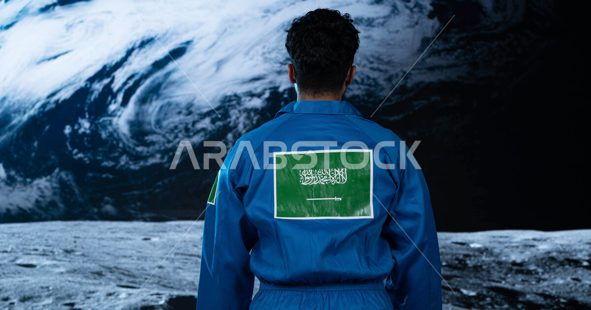 The emblem of the Saudi flag on the blue space suit, the Saudi flight ...