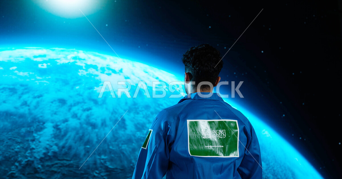 The emblem of the Saudi flag on the blue spacesuit, Saudi Arabia's ...