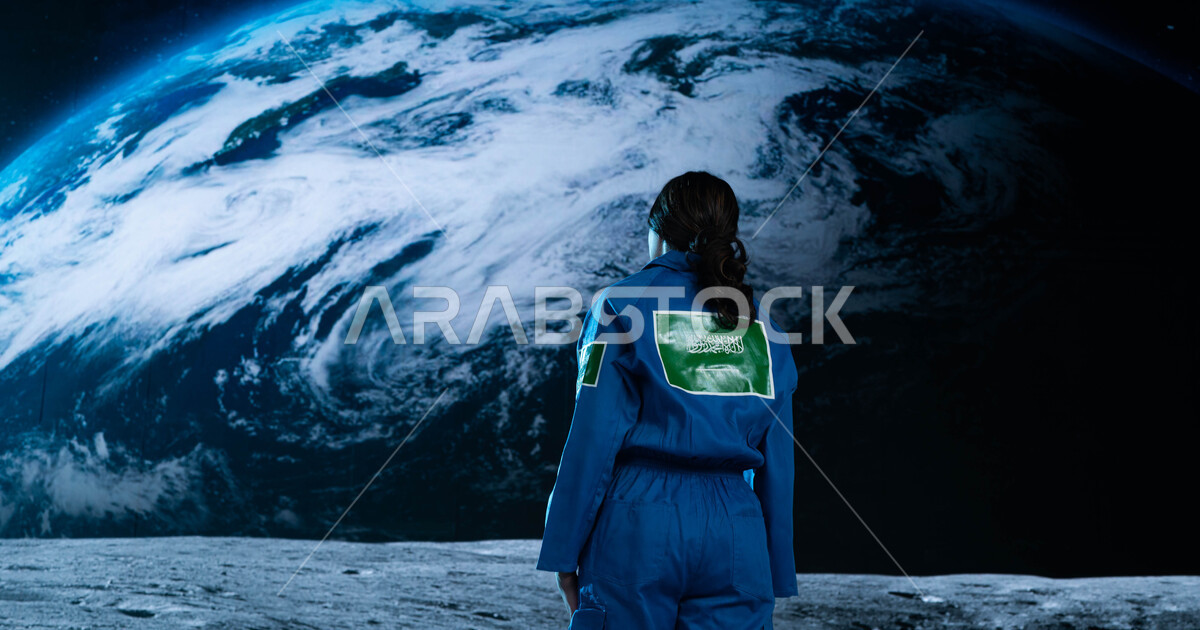 The logo of the Saudi flag on the blue space suit, Saudi Arabia's ...