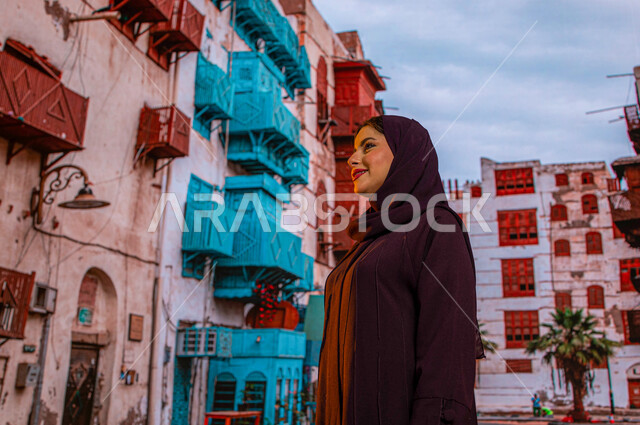 Colorful wooden rawasheen in the old Arab architectural building, a ...