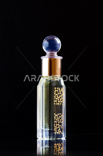 A glass bottle of original Saudi musk oil, perfumed with natural oils ...
