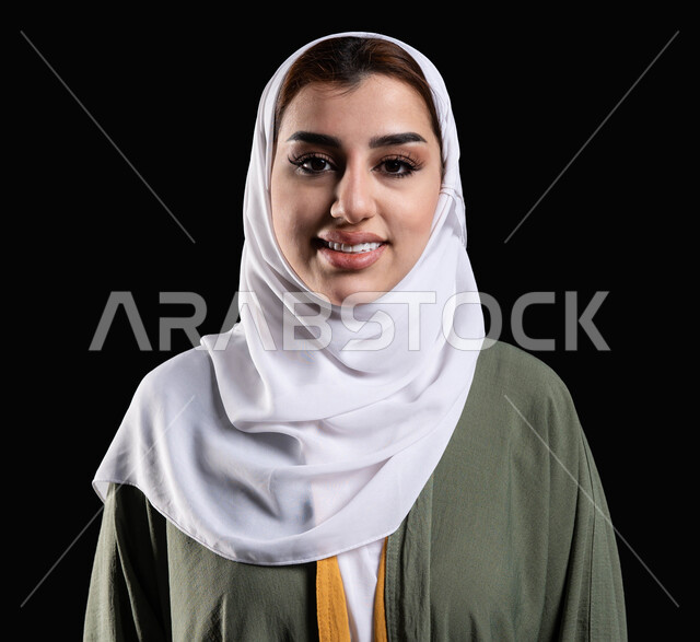 Attention to beauty, elegance and outward appearance, a close-up portrait of a smiling, veiled ...