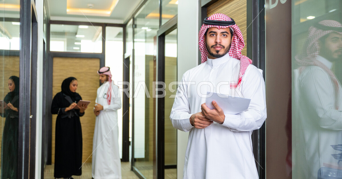A Saudi Arabian Gulf man in traditional dress inside the company's ...