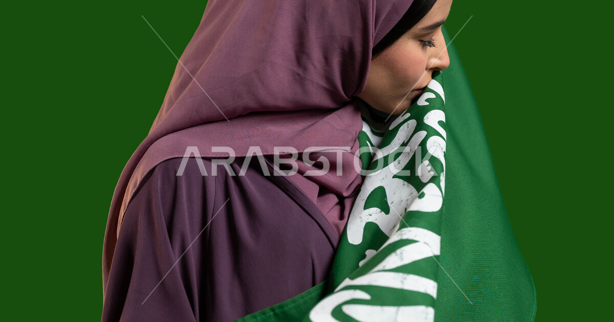 Saudi National Day, portrait of a veiled Saudi Arab Gulf woman wearing ...
