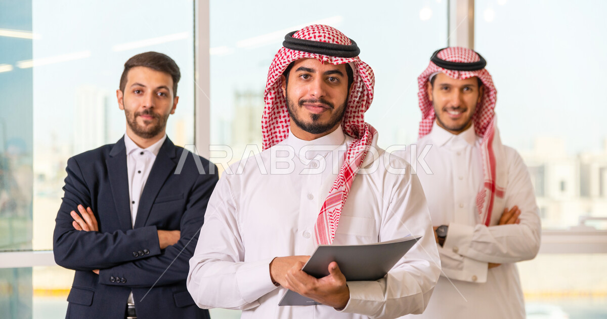 A group of Saudi Gulf entrepreneurs, business partners standing idly by ...