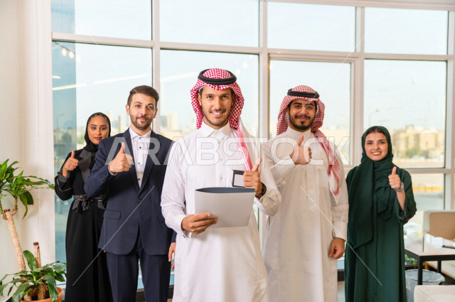 A group of Saudi Arabian Gulf businessmen and businesswomen, one of ...