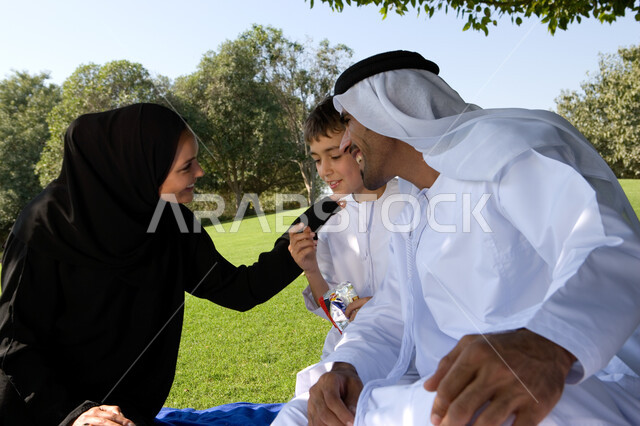 Laughter and fun with the family in a park on the day of the holiday, a ...