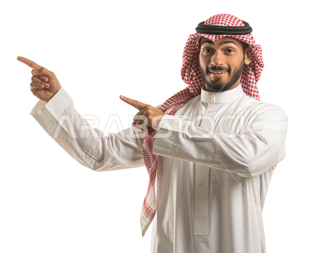 Pointing with the index finger to a place, portrait of a smiling Saudi ...