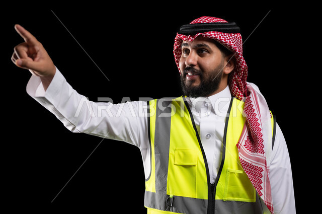 Clicking and pressing on an element, a close-up portrait of a Saudi ...