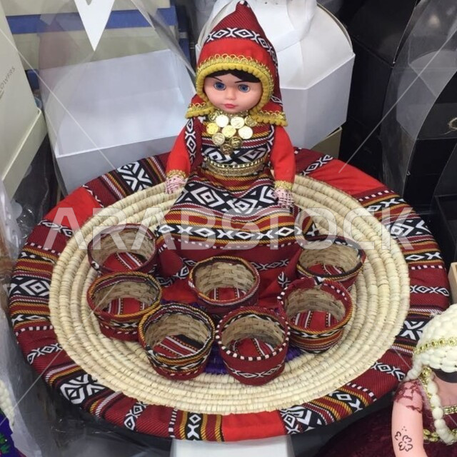 A doll wearing a hijab and the traditional Saudi folk dress, Qerqi’an ...