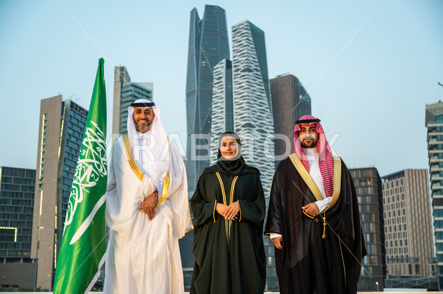 Celebrating Saudi national occasions, wearing traditional folk costumes ...