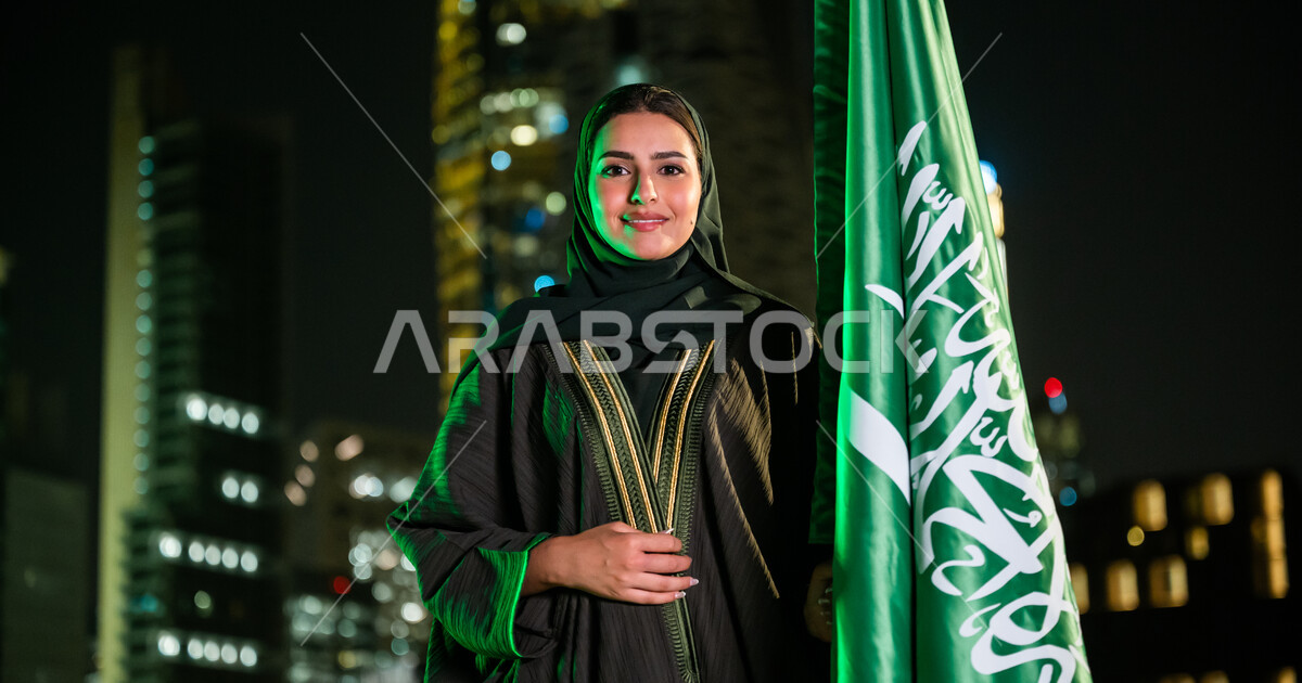 Towers and buildings in Riyadh at night, looking at the camera with ...