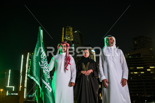 Standing upright and proud next to the flag of the Kingdom of Saudi ...