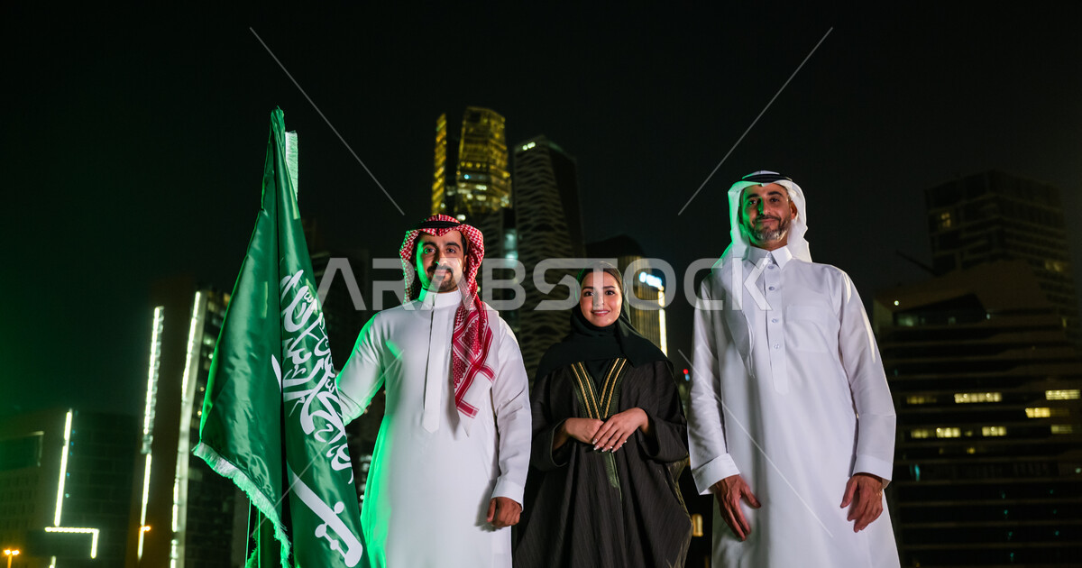 Standing upright and proud next to the flag of the Kingdom of Saudi ...