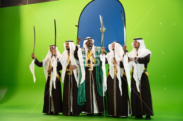 Using the sword with regular movements in the Saudi Ardha, folk dancing ...