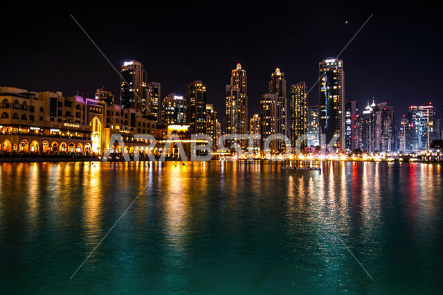 The reflection of the lights and illumination of the towers and ...