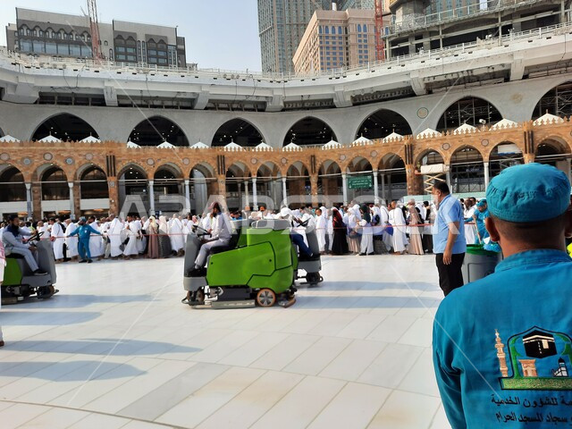 Pilgrims and Muslims in the courtyards of the Holy Mosque in Mecca, the ...