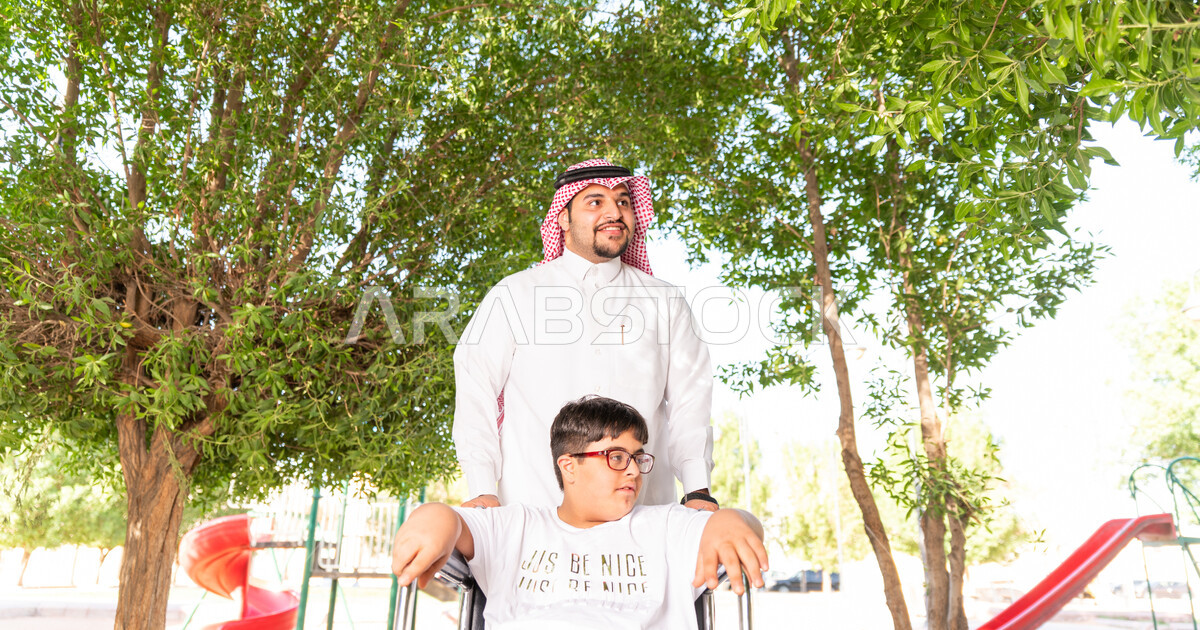 A Gulf boy with Down syndrome spends his time outing with his father in ...