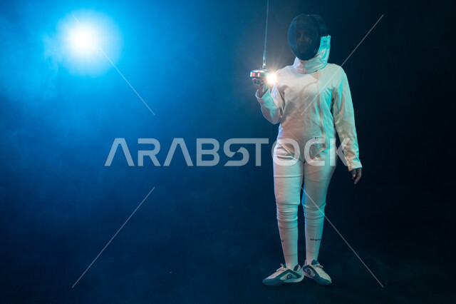 Practicing women's fencing, practicing movements with a fencing sword ...