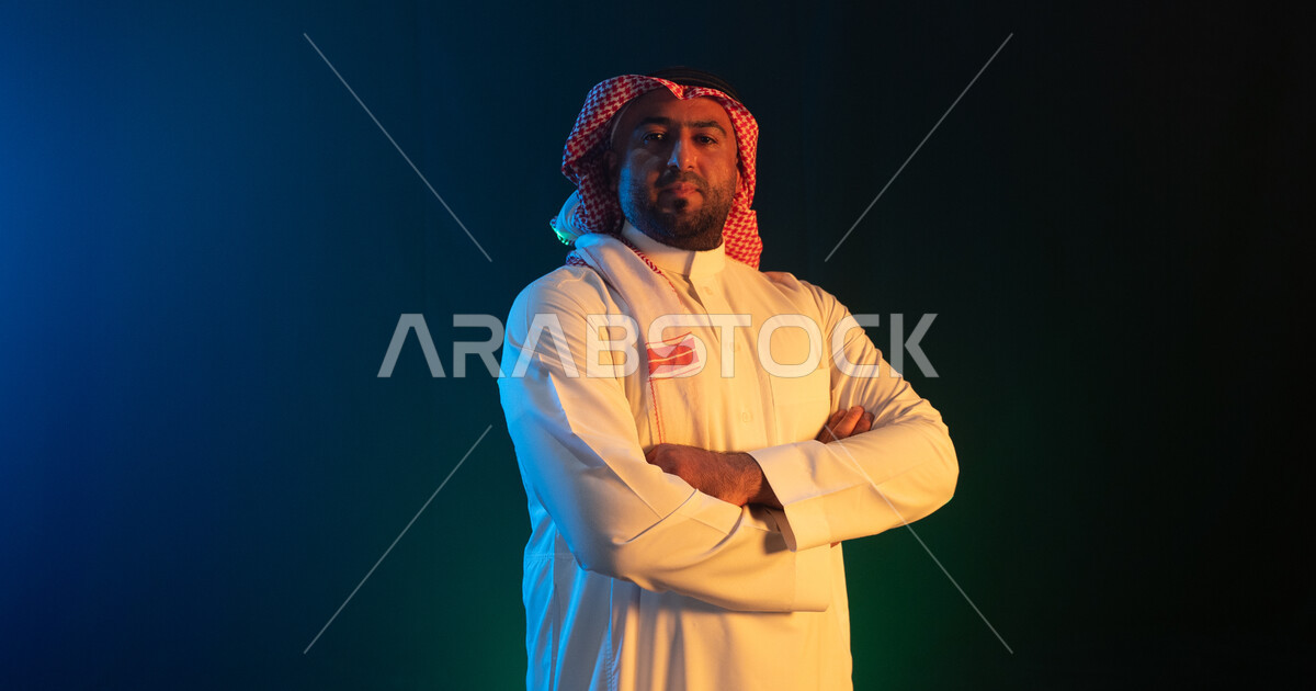 A handsome young man looks at the camera with crossed hand gestures, a ...