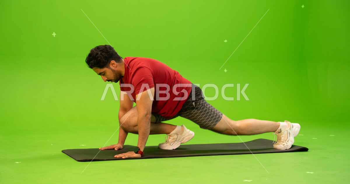Tightening the abdominal muscles, a portrait of a Saudi Gulf Arab young ...