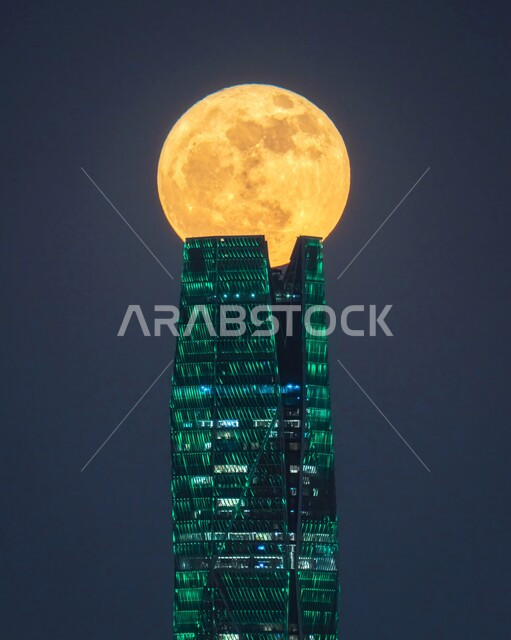 Full moon (Badr) at the top of the King Abdullah Financial Tower (KAFD ...