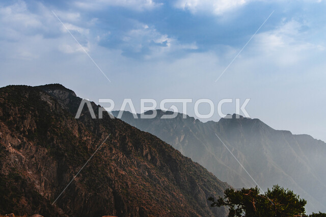 White clouds and clouds, foggy atmosphere over the Al-Soudah Mountains ...