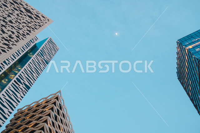 The illuminated economic and financial towers at night in the city of ...