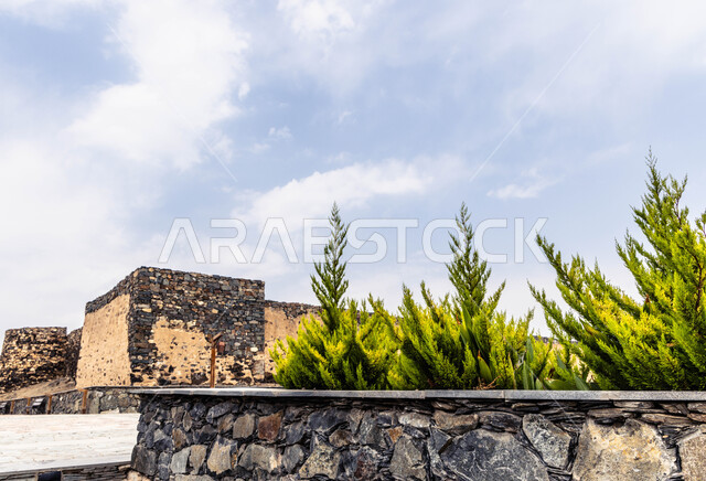 The stone wall surrounding the historic Shamsan Castle in the city of ...