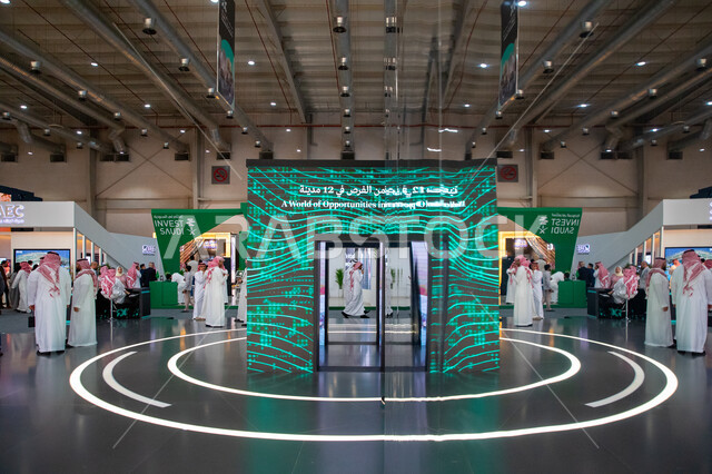 An electronic digital screen with the phrase “A World of Opportunities ...