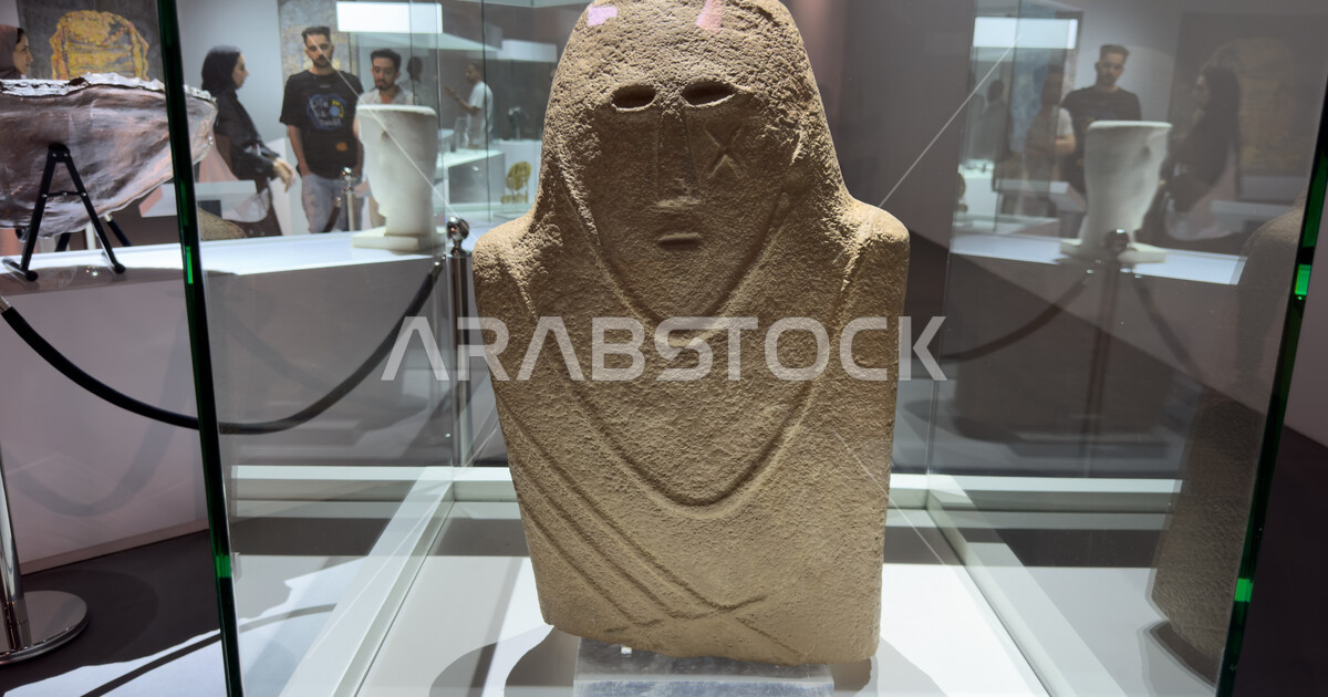 A close-up photo of a historical human statue in an exhibition between ...