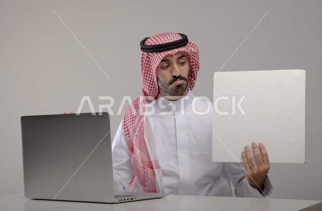 Sadness and gestures indicating loss, portrait of a Saudi Gulf Arab man ...