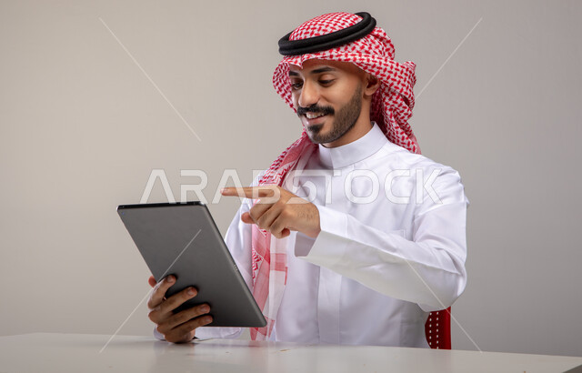 Clicking and tapping gestures on the tablet, portrait of a smiling ...