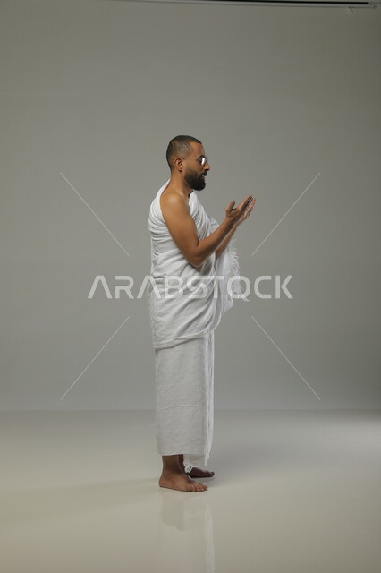 Supplication, worship, and getting closer to God, a side portrait of a ...