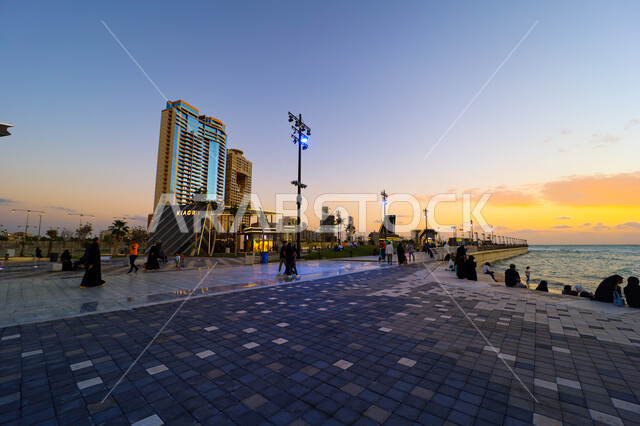 Tourists gather in the Jeddah Art Promenade area on the shore of the ...
