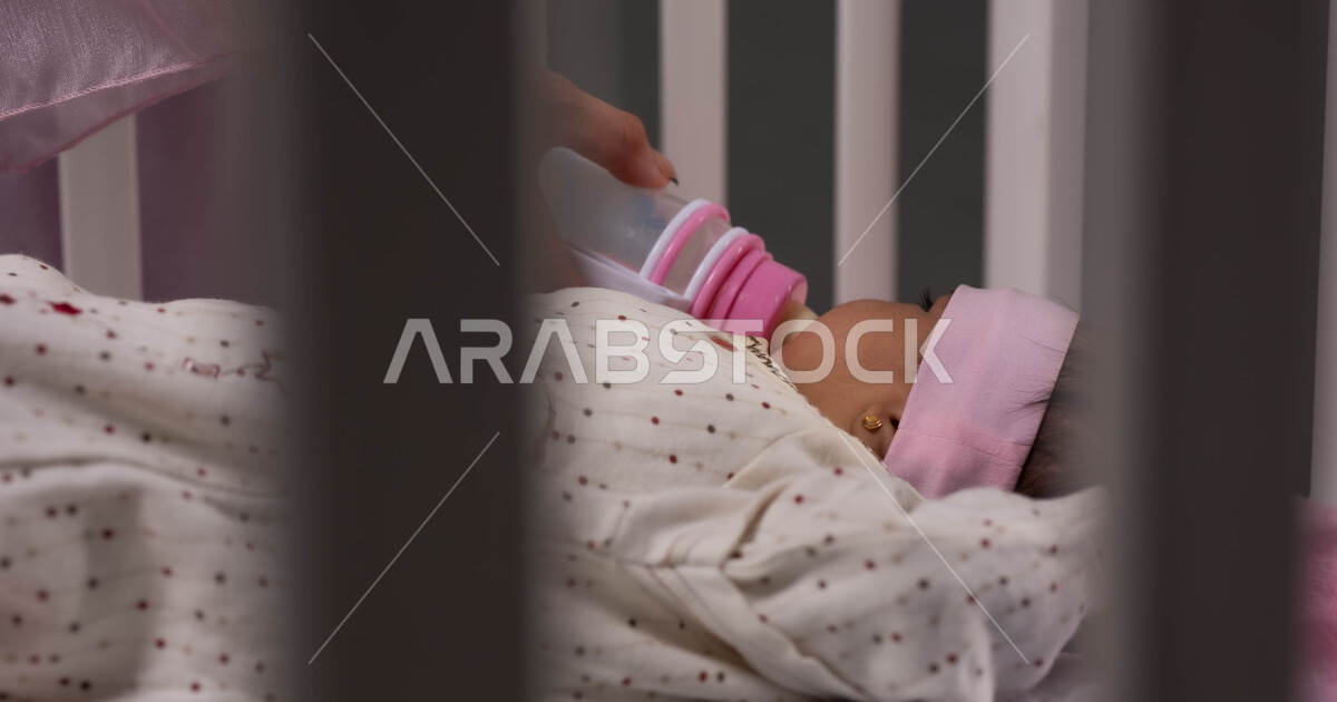 The concept of artificial feeding, using a feeding bottle to drink milk ...