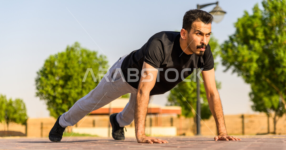 A young Saudi Gulf man practicing outdoor morning sports, walking ...