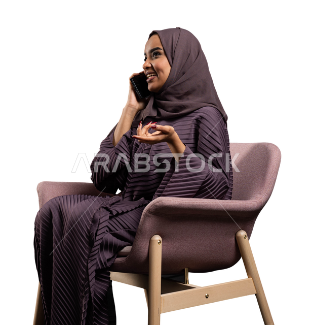 Making phone calls, portrait of a veiled Saudi Arabian Gulf woman ...