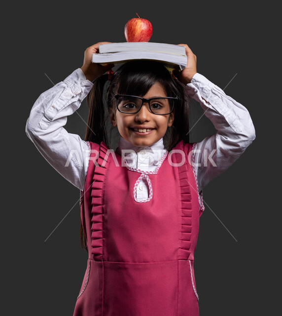 An intelligent and intelligent girl looks at the camera with joyful ...