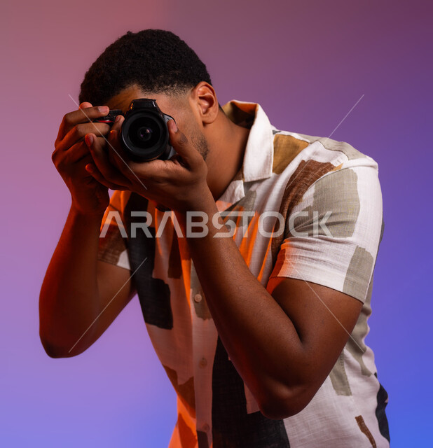 Zooming in using a magnifying glass, a close-up portrait of a Saudi ...