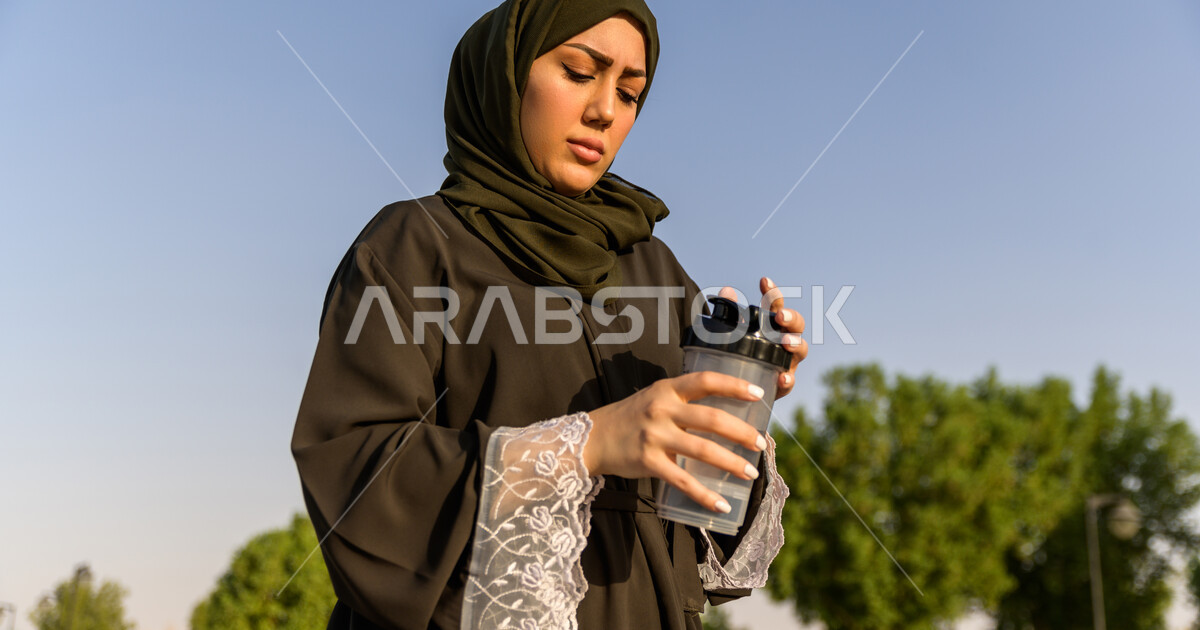 A young Saudi Arabian girl practicing outdoor morning sports, walking ...