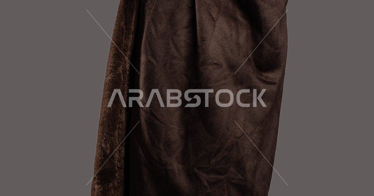 The extreme cold of winter, a portrait of a Saudi Gulf Arab man wearing ...