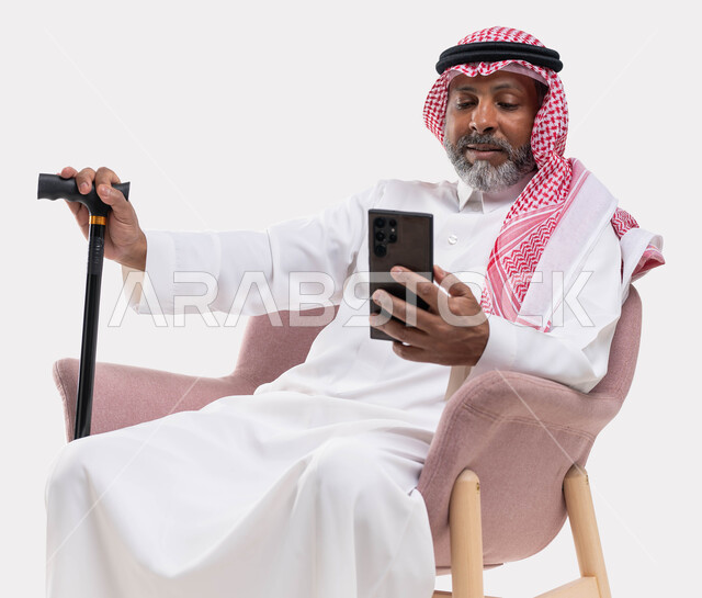 Browsing social networking sites, a portrait of an elderly Saudi ...