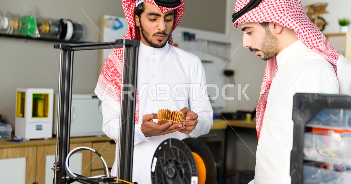 Two innovative young Saudis use a 3D printer to manufacture a product ...