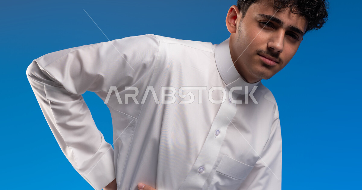 Looking at the camera, feeling pain in the spine, a close-up portrait ...