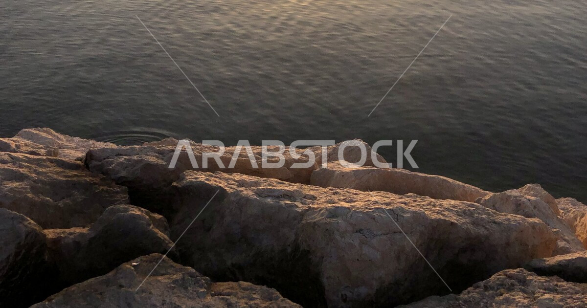 Large rocky stones on the Red Sea coast, sunset view on the waterfront ...