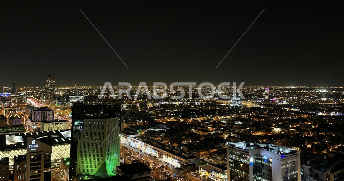 Towers and skyscrapers illuminated at night, famous tourist attractions ...