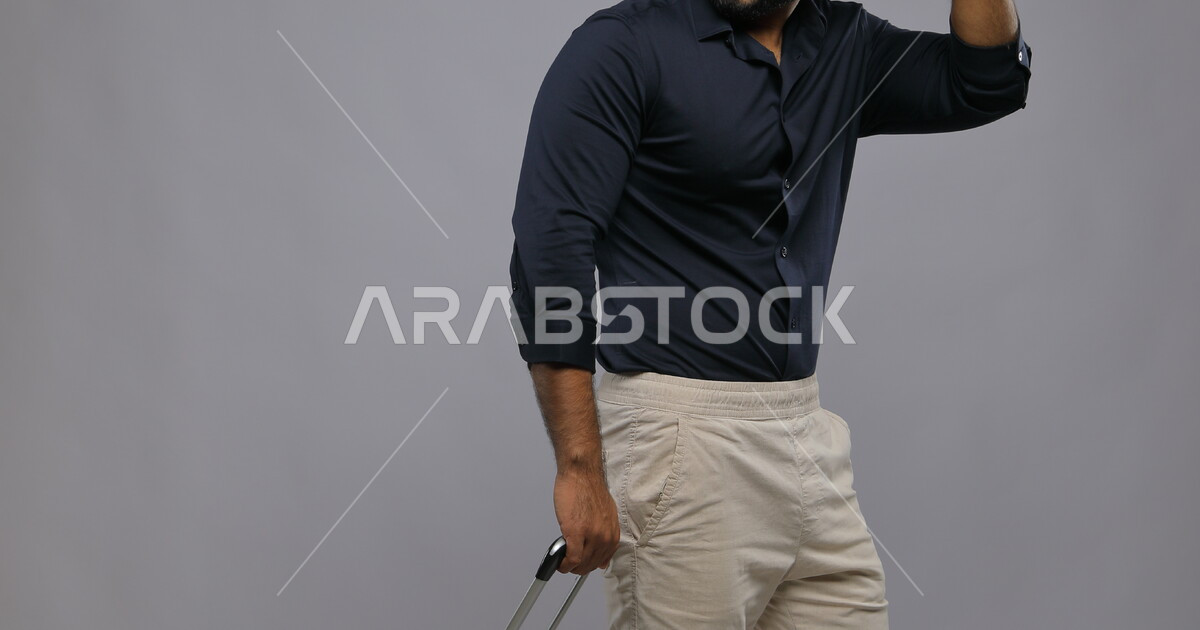Waving and farewell gestures, portrait of a smiling Saudi Gulf Arab ...