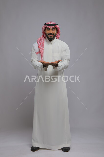 Standing straight and looking at the camera, portrait of a smiling ...